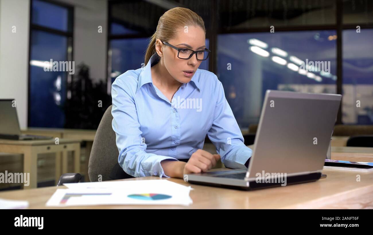 Angry accountant working on laptop, problems with financial report ...