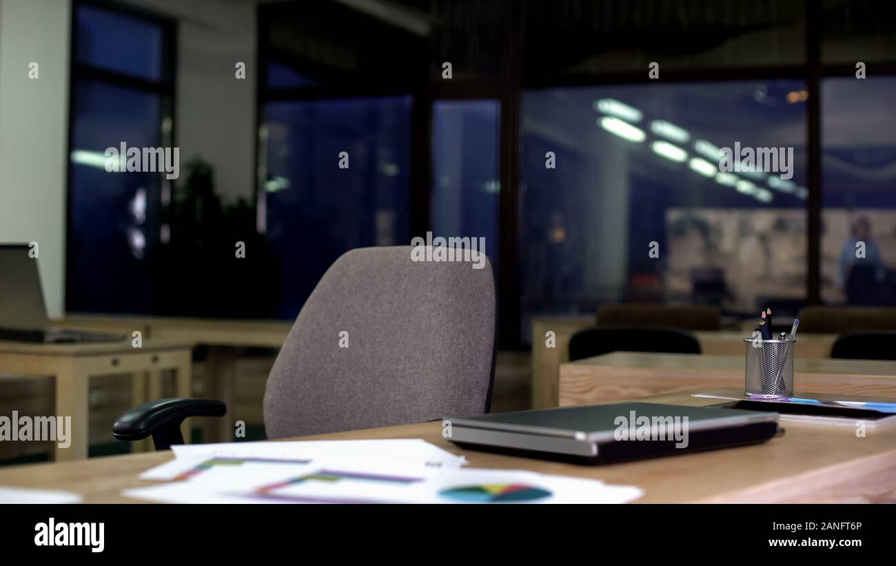 Empty office, employees preparing to go home, end of working day ...