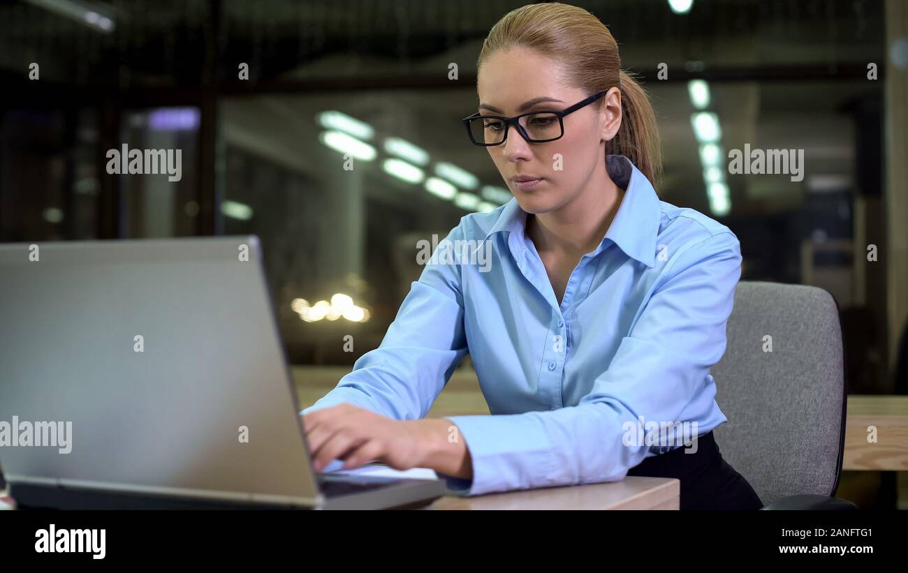 Serious employee working on laptop hi-res stock photography and images ...