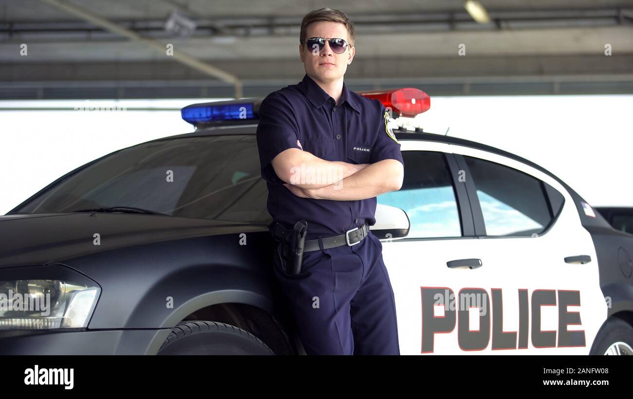Policeman with sunglasses hi-res stock photography and images - Alamy