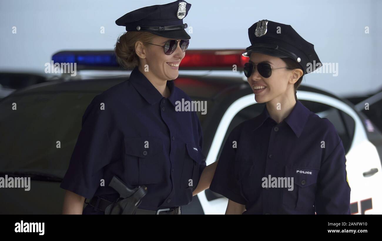 Female police officer smiling hi-res stock photography and images - Alamy