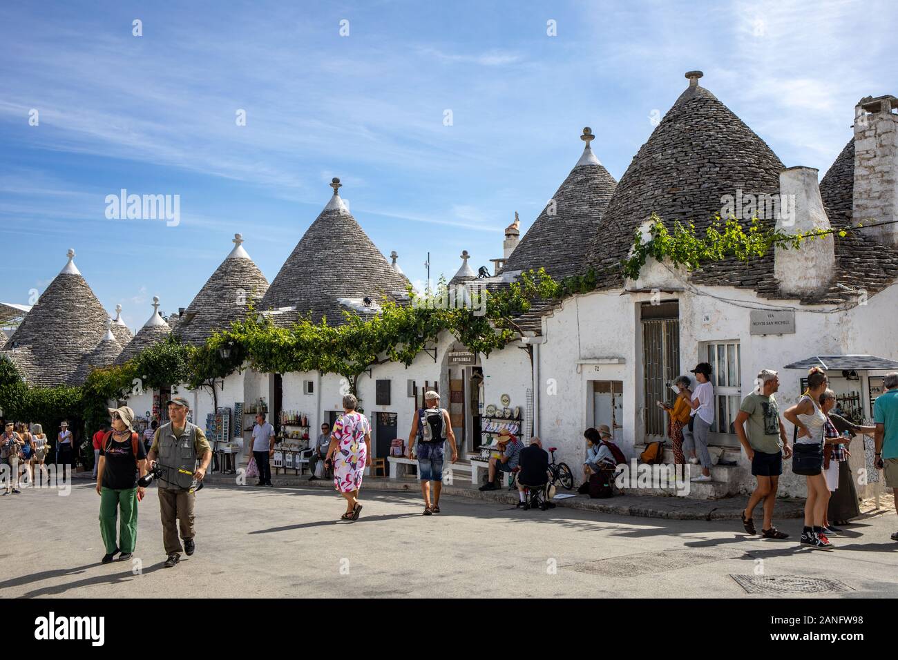 Alberobello, Italy - September 16, 2019: People visit Trulli village in ...