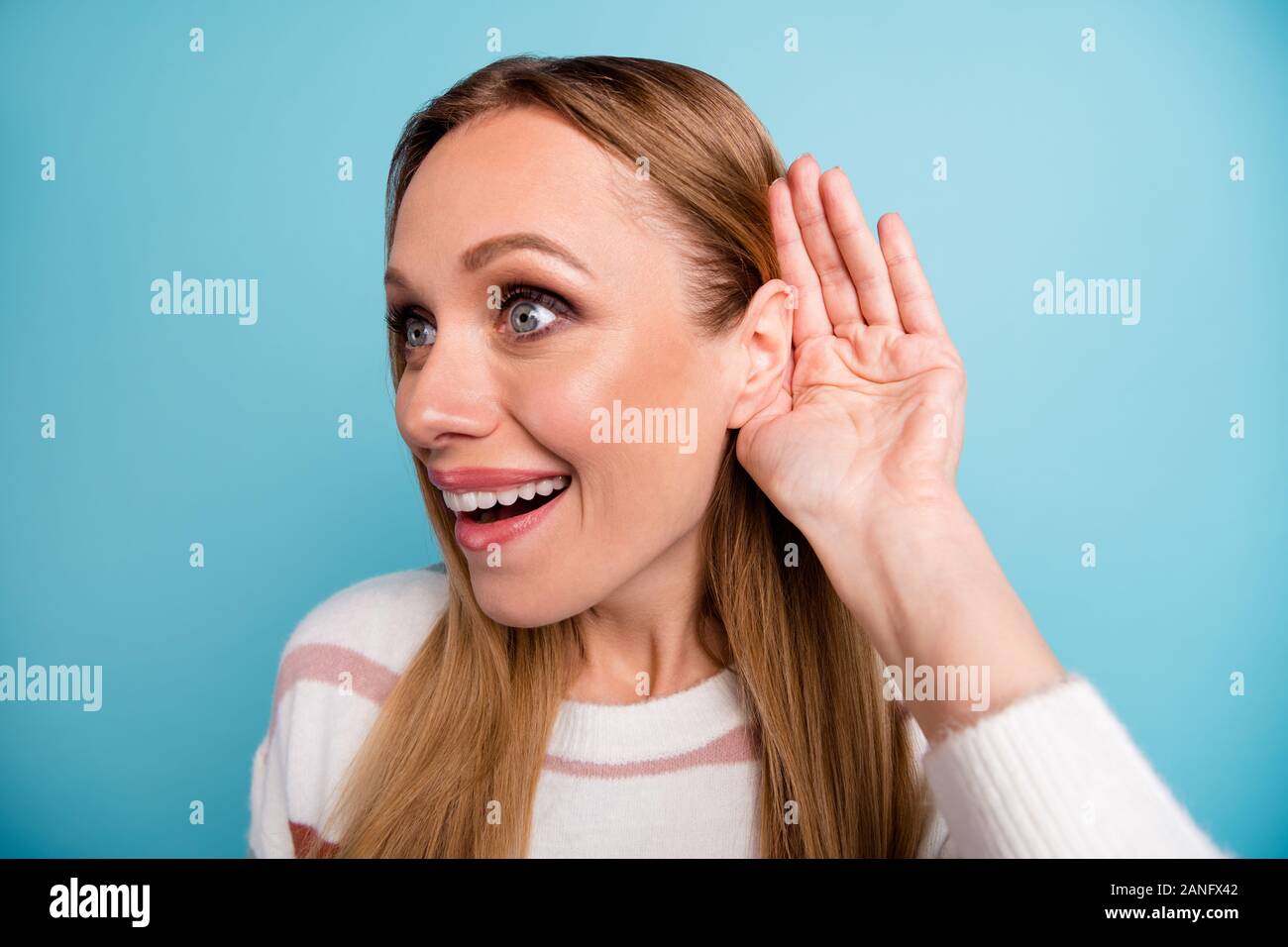 Close up portrait of cheerful excited overjoyed woman hearing ...