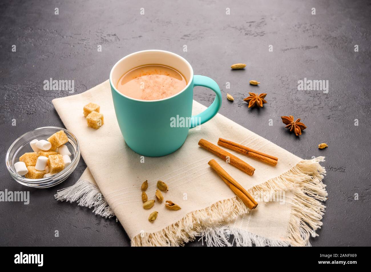 Traditional Indian masala tea chai with milk and spices on napkin on ...