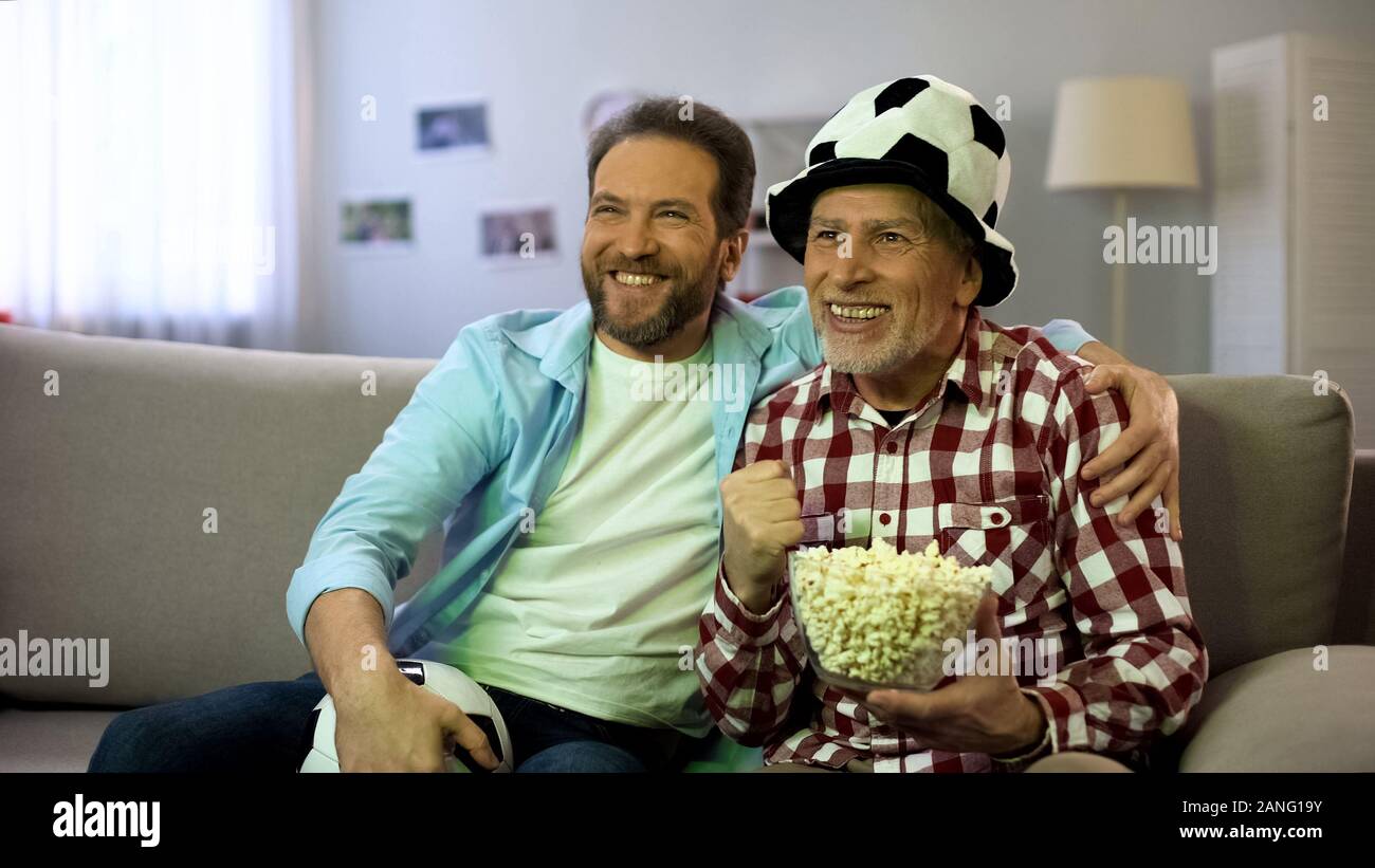 Father son watching football on hi-res stock photography and images - Alamy