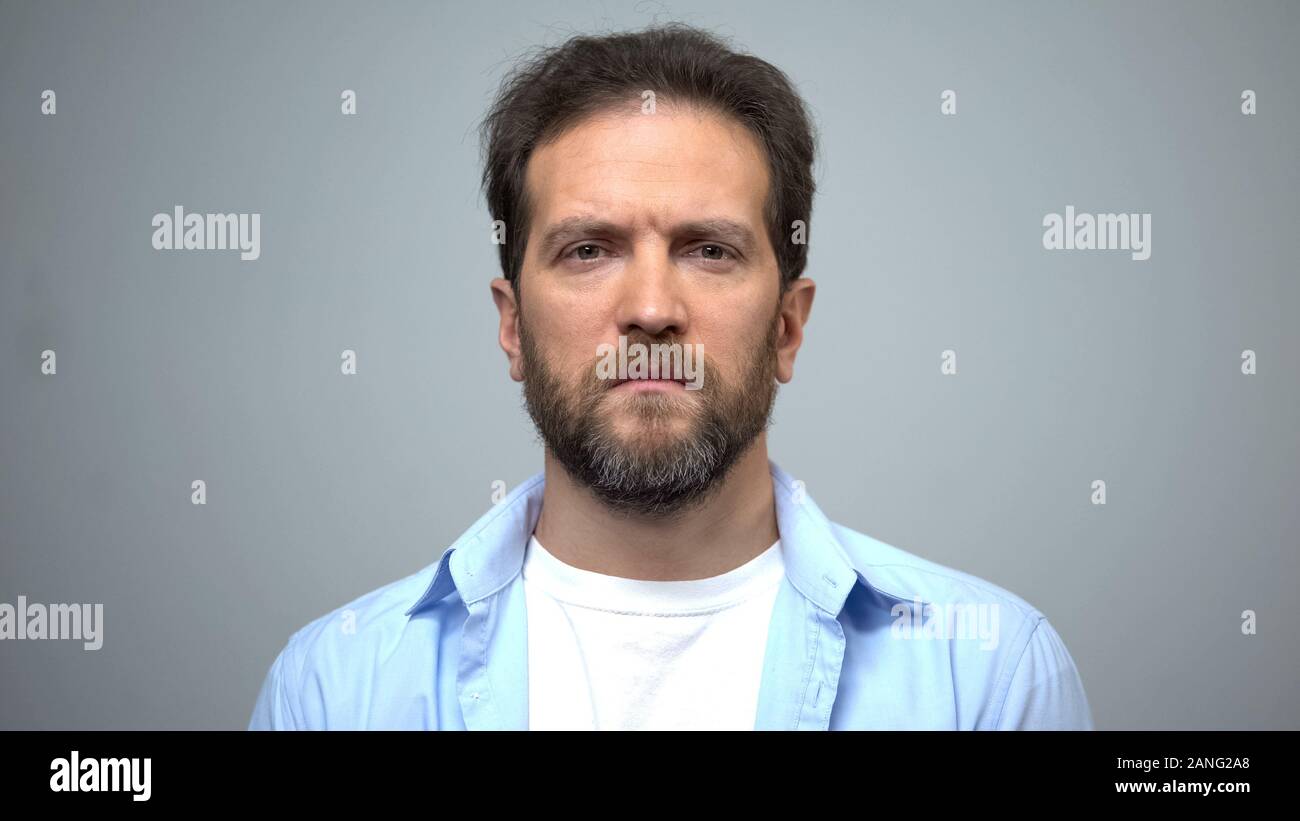 Middle aged man looking to camera sad hi-res stock photography and ...