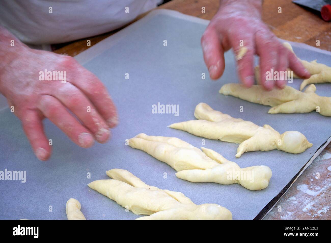 Chef cooking prepares sweet Christmas buns with raisins Stock Photo - Alamy