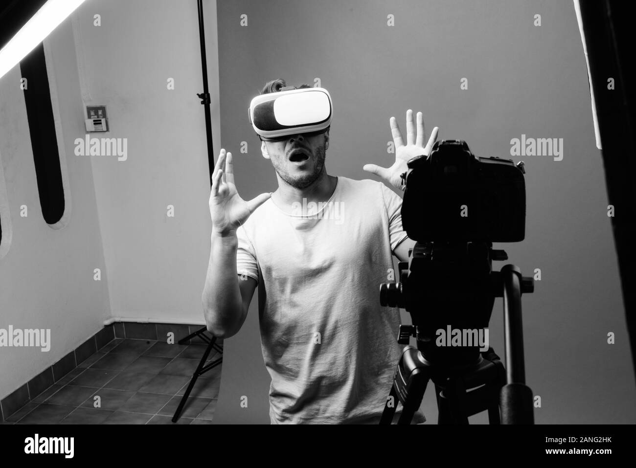 Young handsome Hispanic man vlogging with camera Stock Photo - Alamy