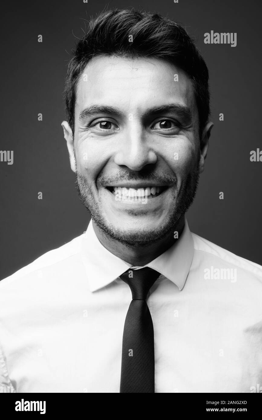 Happy hispanic business man smiling Black and White Stock Photos ...