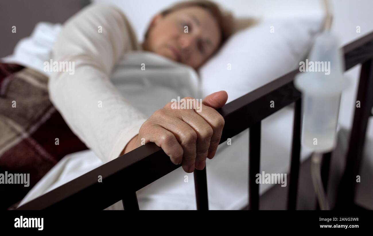 Old woman hospital bed weak hi-res stock photography and images - Alamy