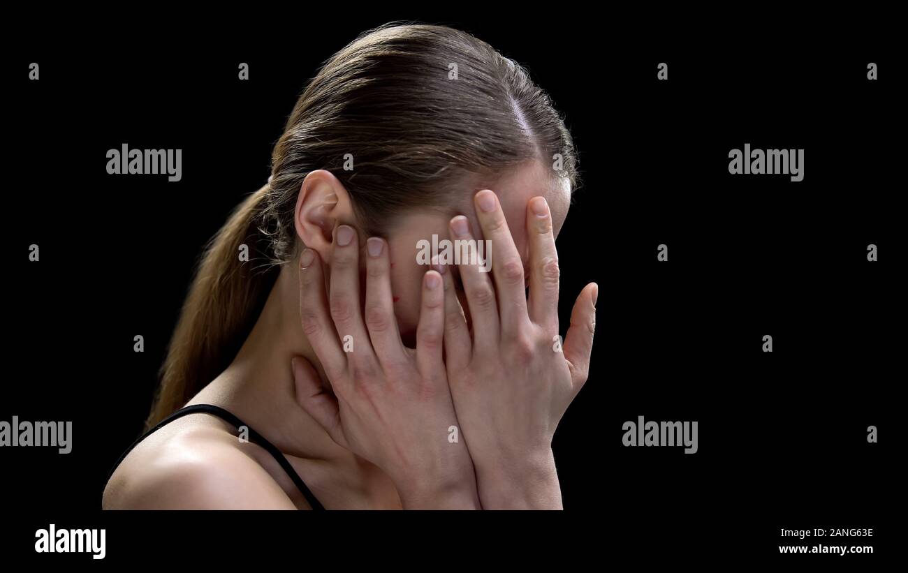 Female closing face, suffering mental disease, feeling insecure and ...
