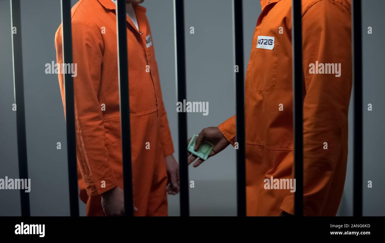 Black male prisoner giving bribe to caucasian inmate, faulty system ...