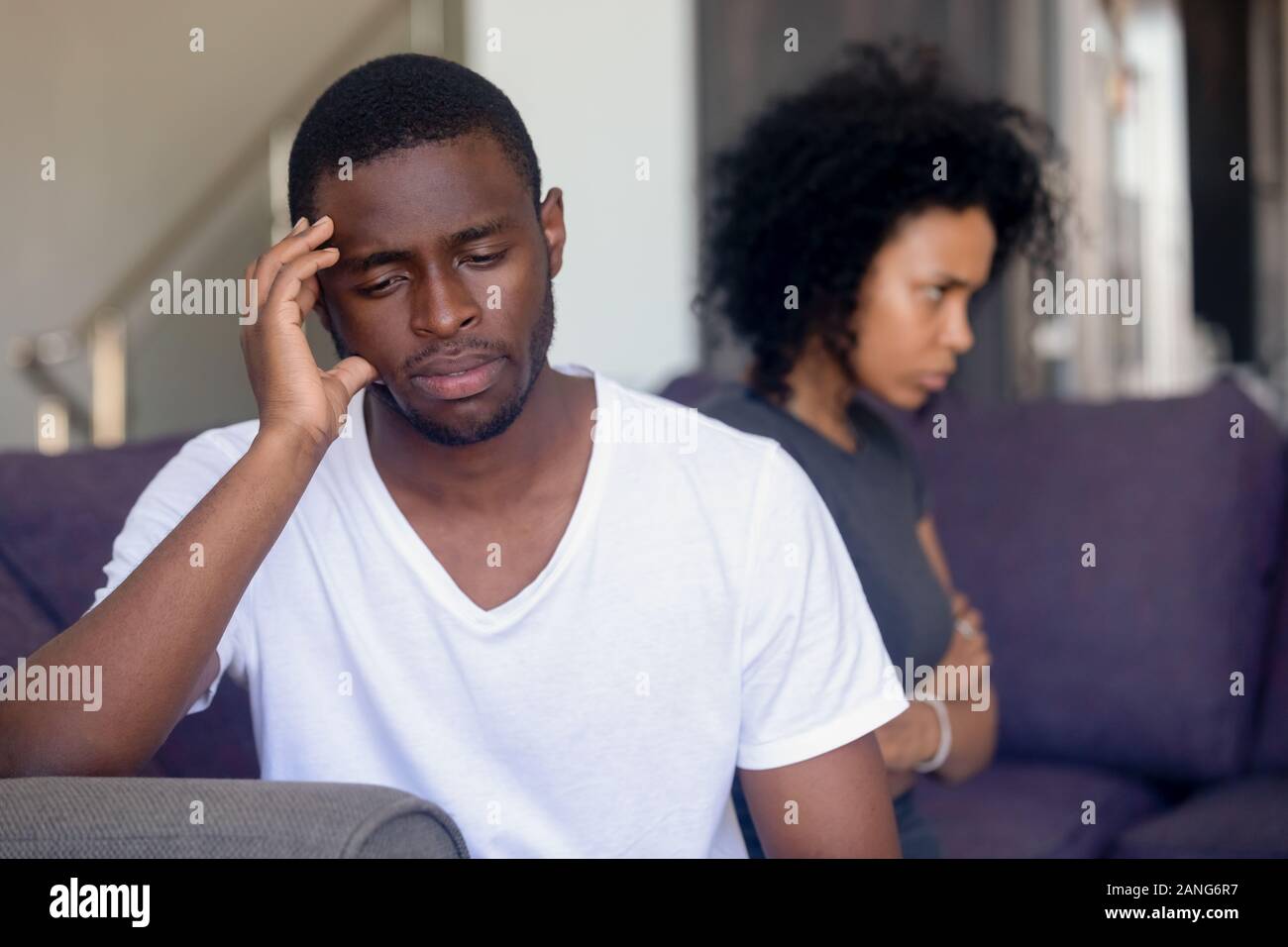 Unhappy black husband think of separation after fight Stock Photo - Alamy