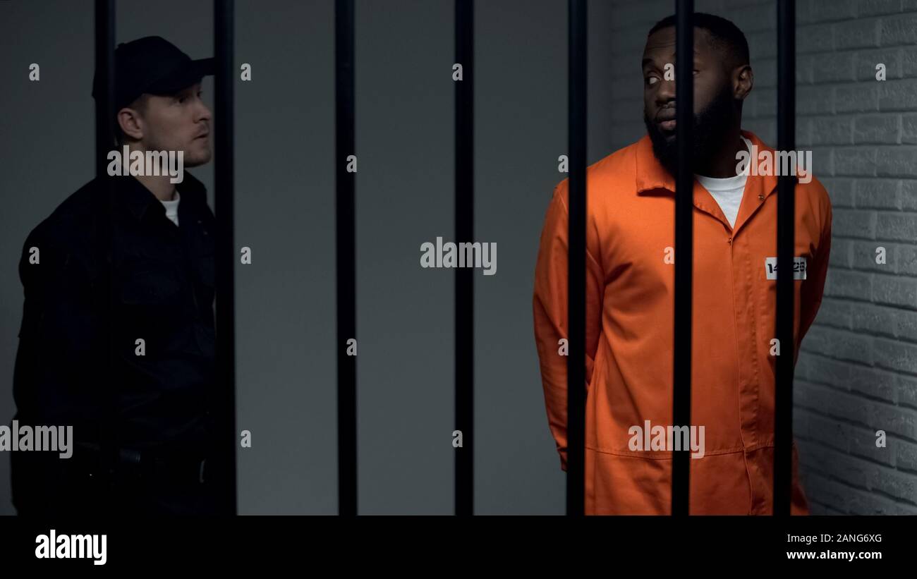 Police escorting handcuffs hi-res stock photography and images - Alamy