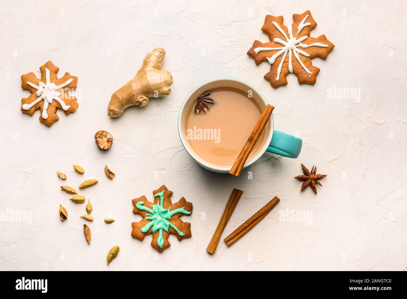 Traditional Indian masala tea chai with milk and spices on white ...