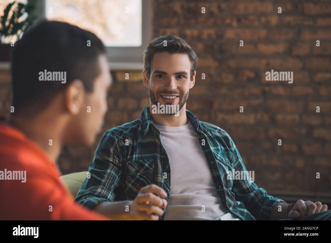 Joyful happy man smiling to his friend Stock Photo - Alamy Joyful happy man smiling to his friend Stock Photo - Alamy