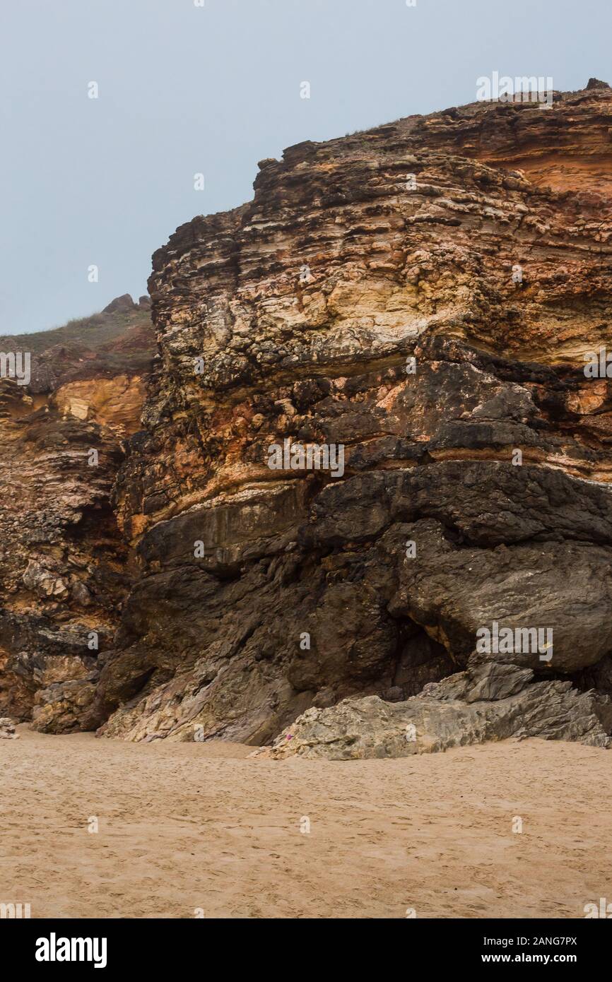Beach of Nazare, Portugal. Cliff and sand Stock Photo - Alamy