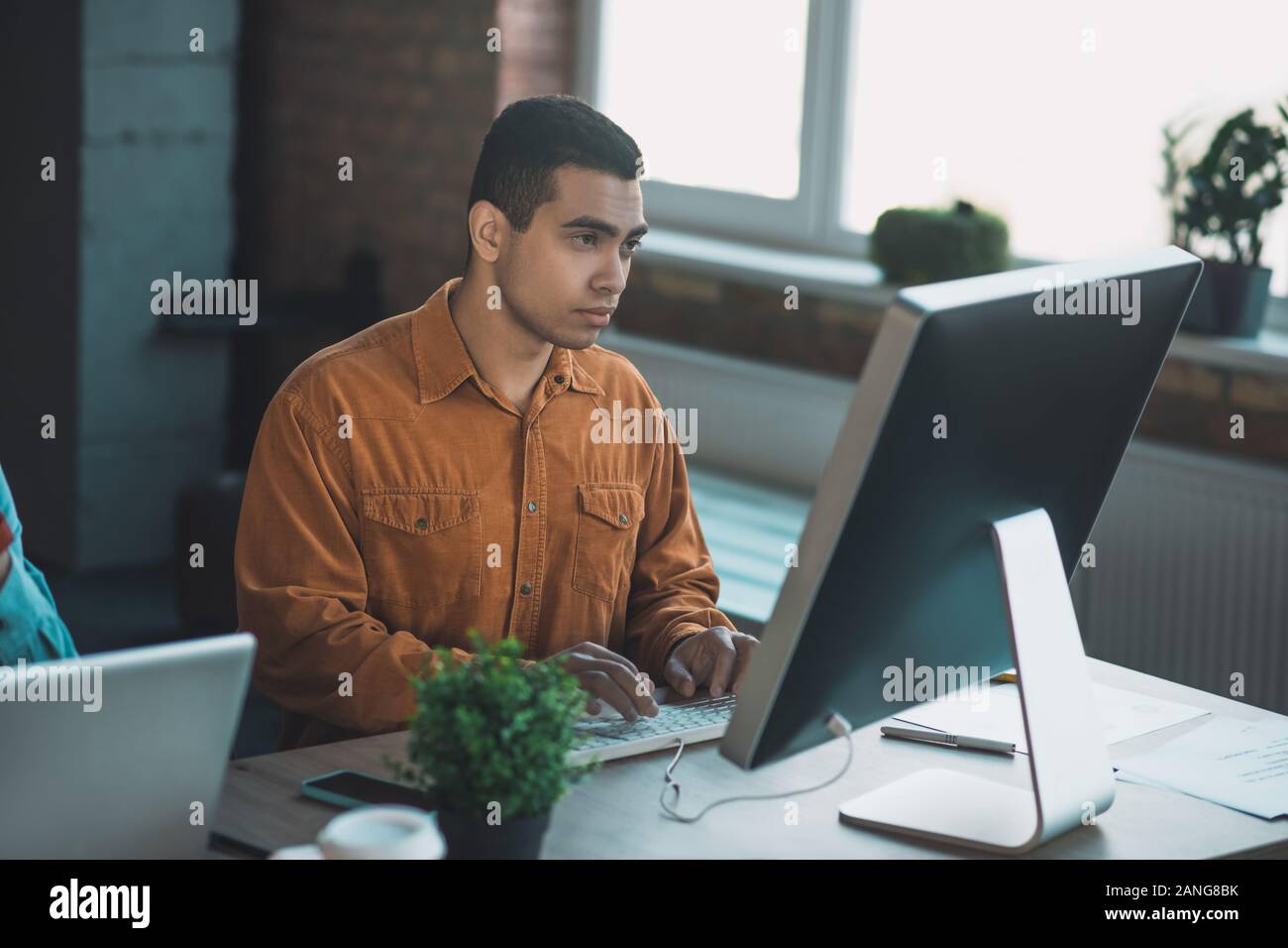 Smart good looking man typing the text Stock Photo - Alamy