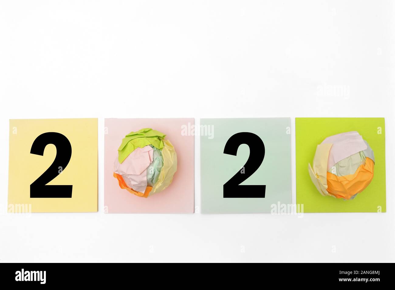 Abstract Year 2020 Sign On Post-It Note And Paper Balls Stock Photo - Alamy