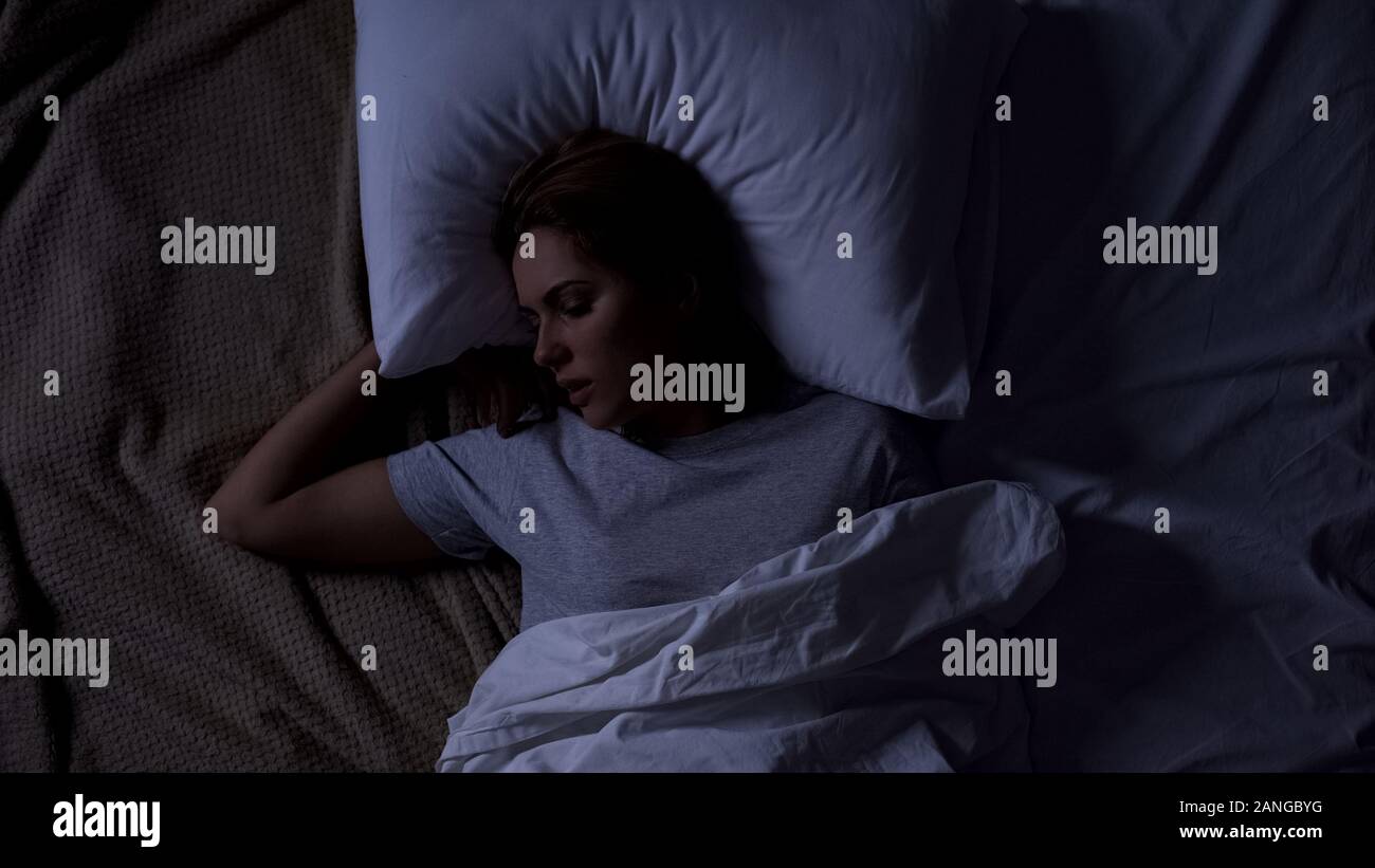 Beautiful female snoring in bed, serious health problems, sleep apnea ...