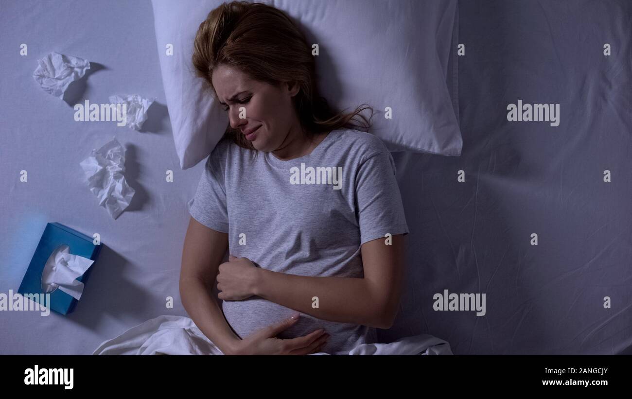 Pregnant woman crying hi-res stock photography and images - Alamy