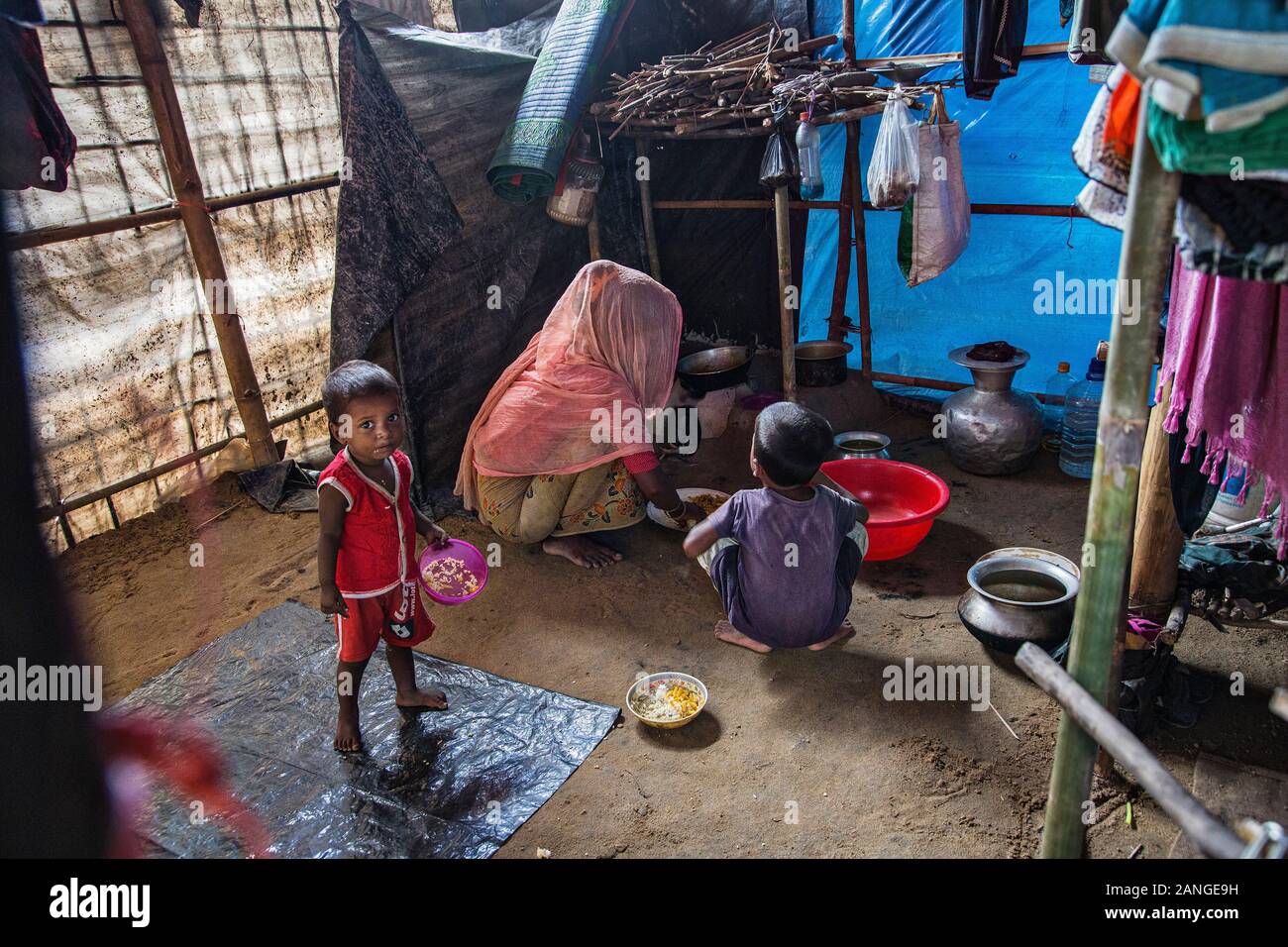 Rohingya refugee in Bangladesh, Thangkhali's camp: a woman cooking some ...