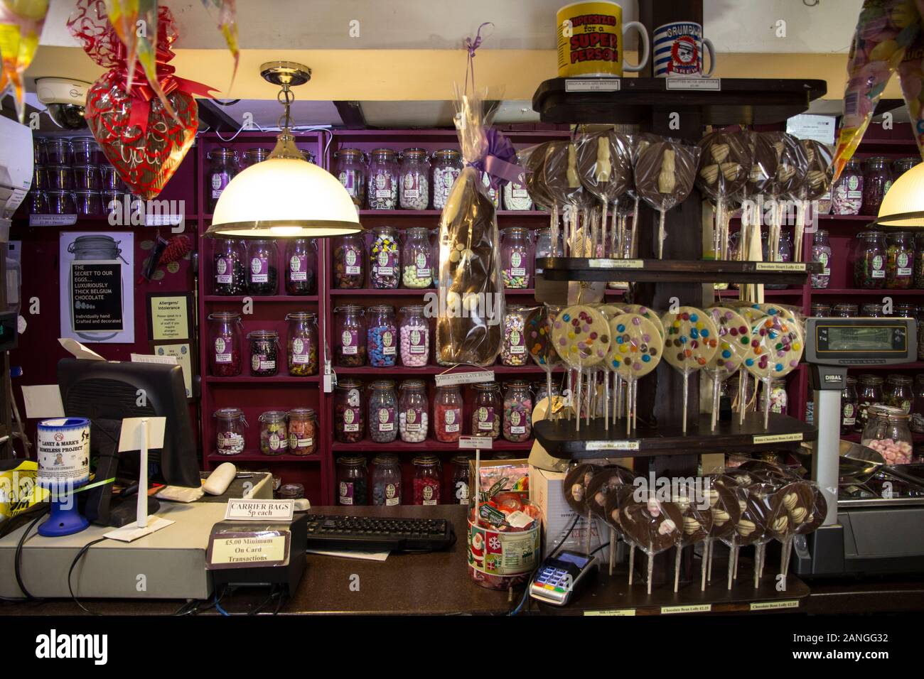 BATH, UK - APRIL 10, 2019. Interior of sweetshop with bottle and jars ...