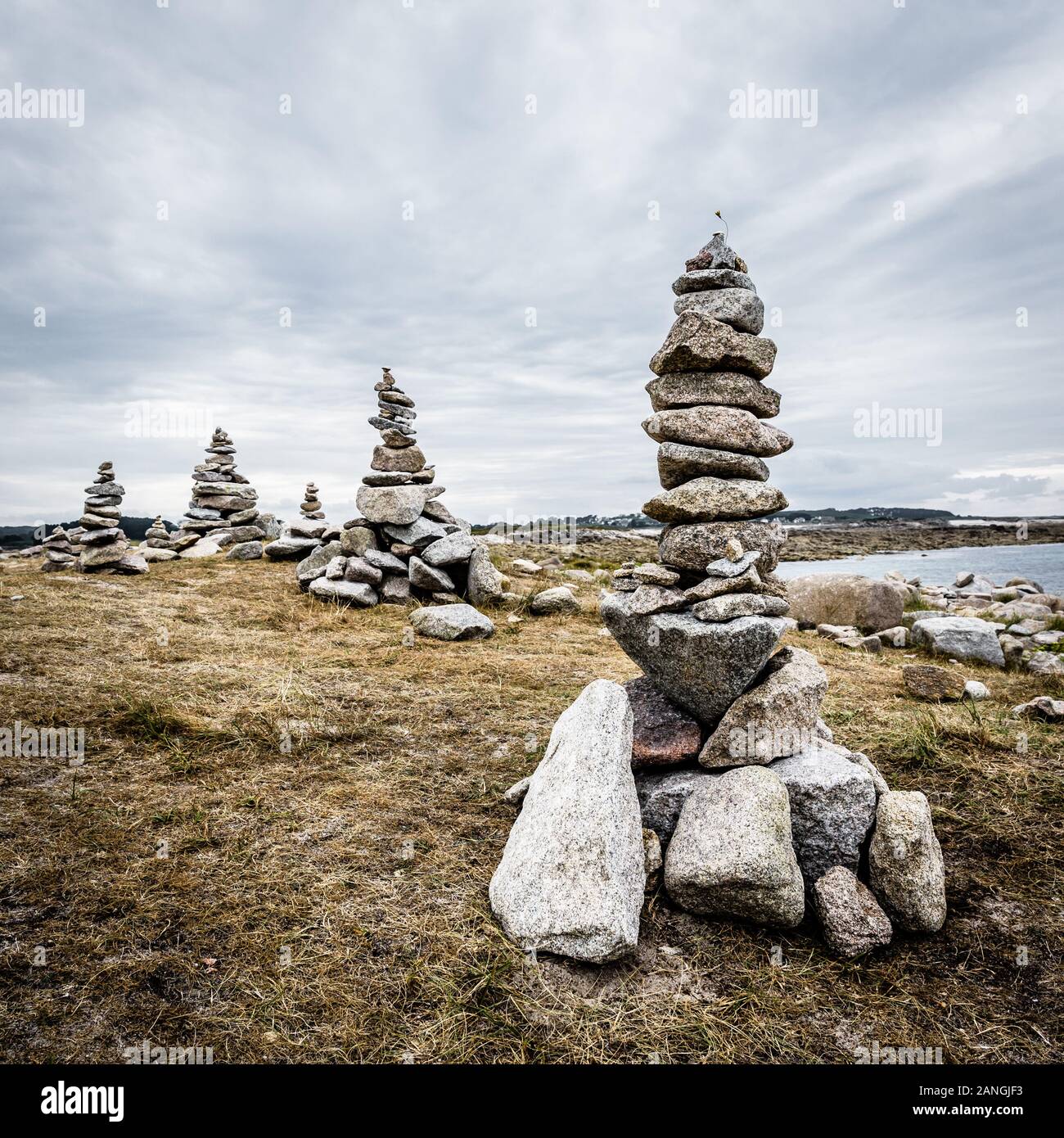 Several man-made granite stone stacks (called cairns) on the coastal ...