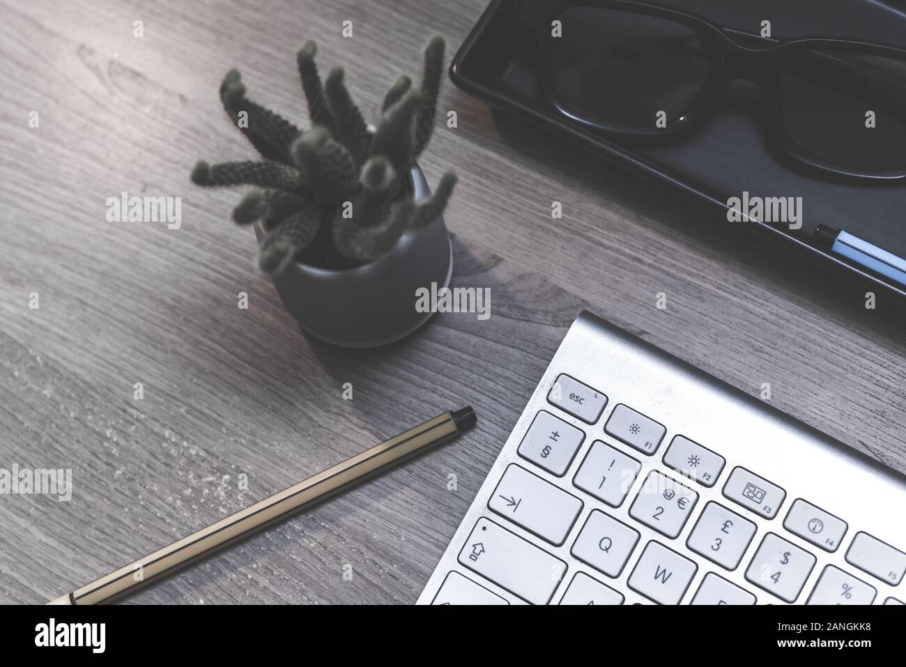 Modern office desk overhead in home office with computer keyboard and ...