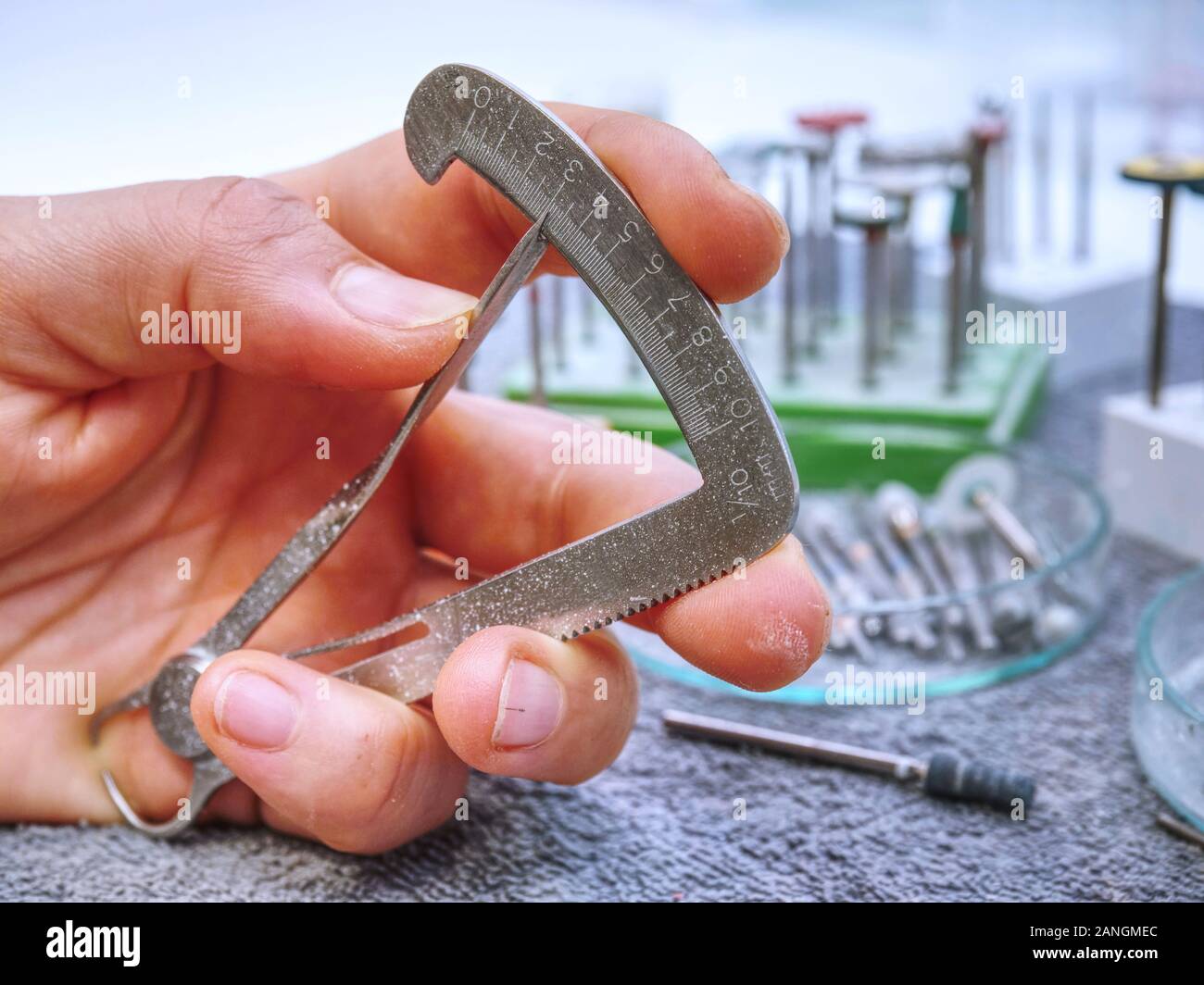 Measurement tool in dentist laboratory. Steel calibrated scale and is ...