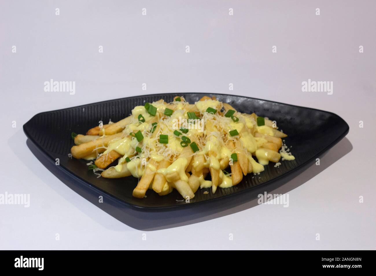 Cheddar cheese fries hi-res stock photography and images - Alamy