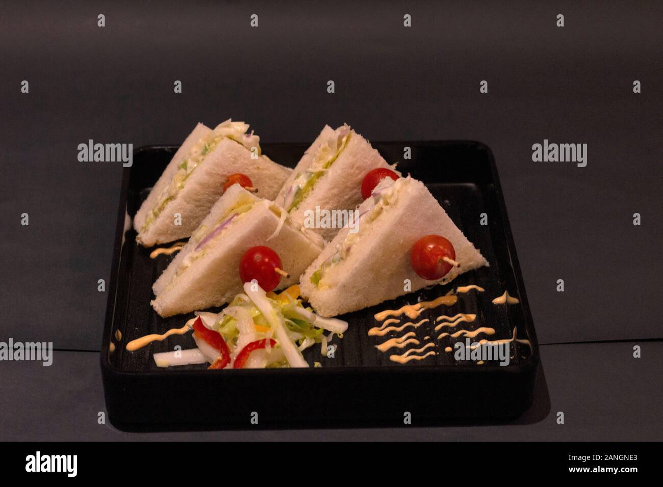 Sandwiches table top shot on black background, India Stock Photo - Alamy