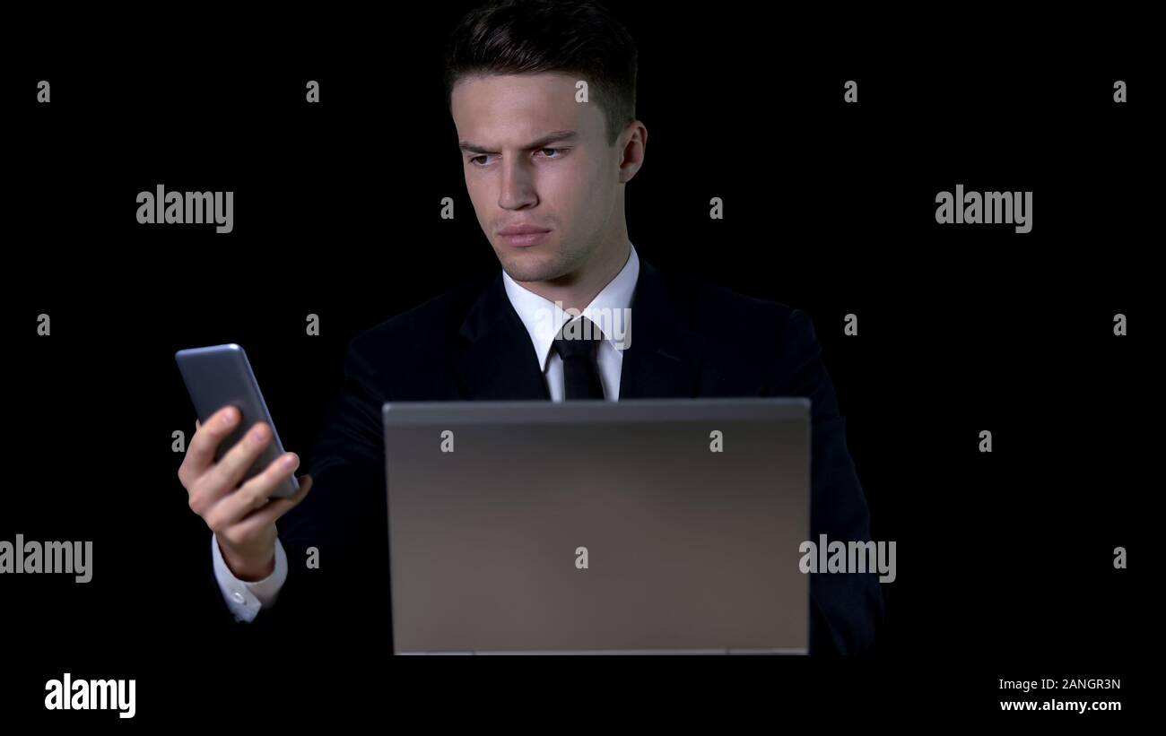 Thief or hacker hacking smartphone by key hi-res stock photography and ...