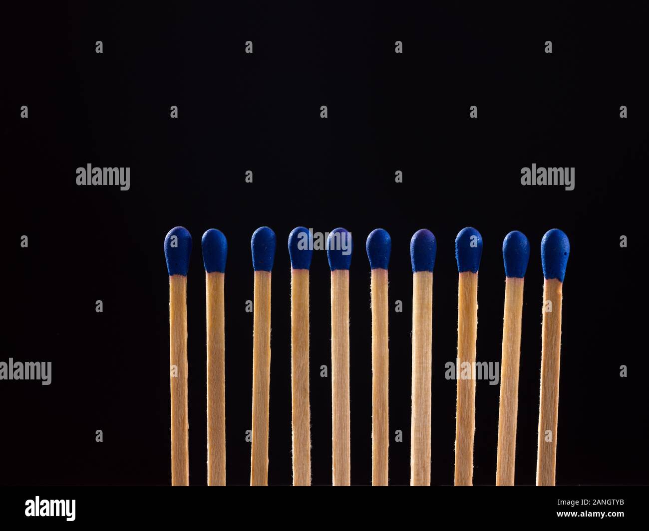 blue matchsticks in black background Stock Photo - Alamy