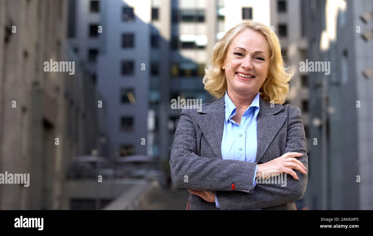 Smiling mature female manager hi-res stock photography and images - Alamy