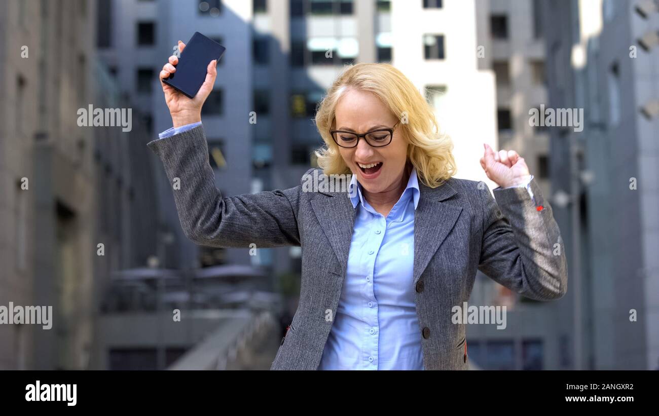 Successful office worker dancing outdoors hi-res stock photography and ...