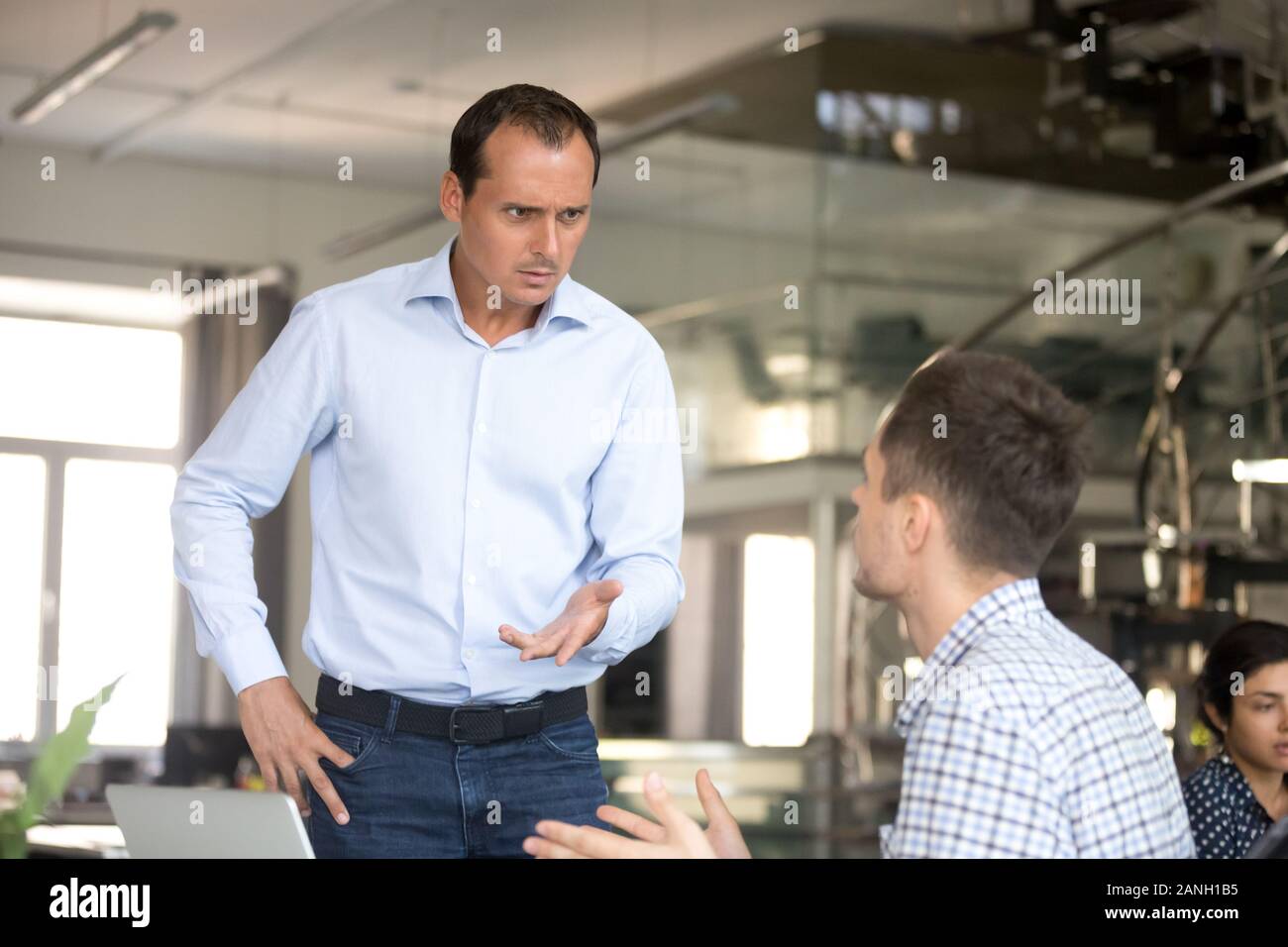 Mad male employer dispute with millennial employee lecturing or blaming ...