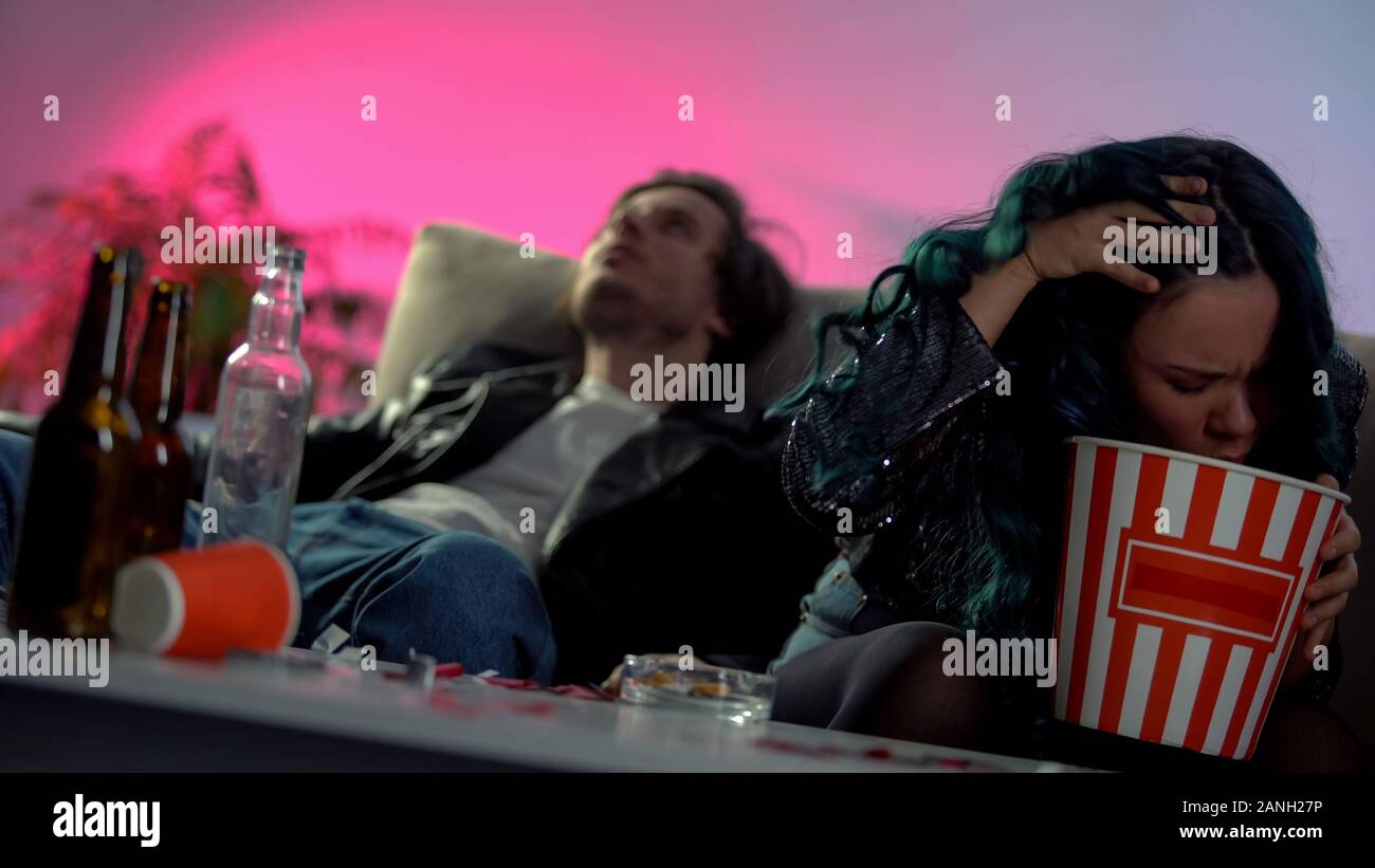 High girl feeling sick and vomiting at party, intoxicated man relaxing ...