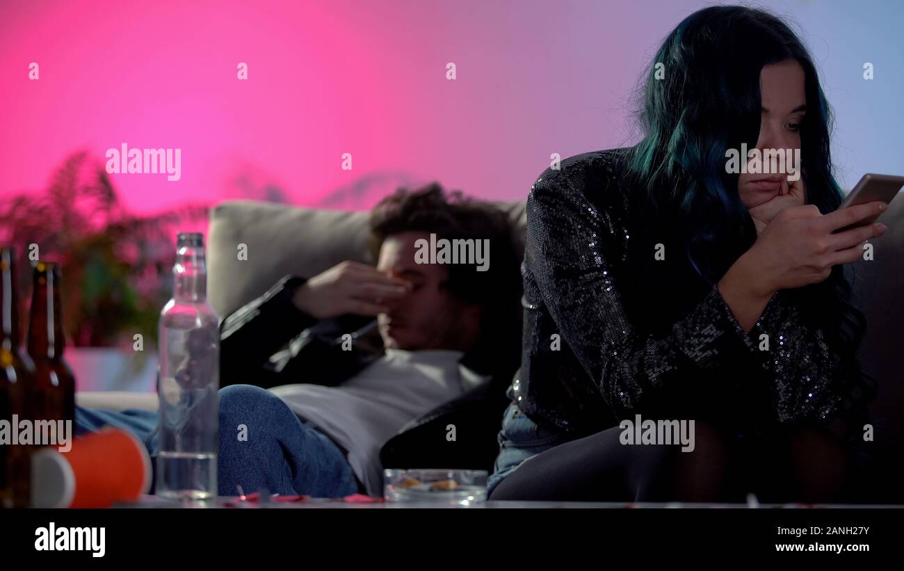 Morning after party, intoxicated girl scrolling gadget, hangover man ...