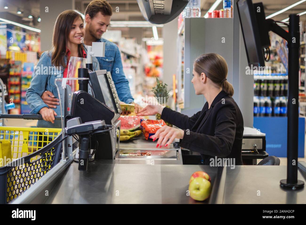 Couple buying goods in a grocery store Stock Photo - Alamy