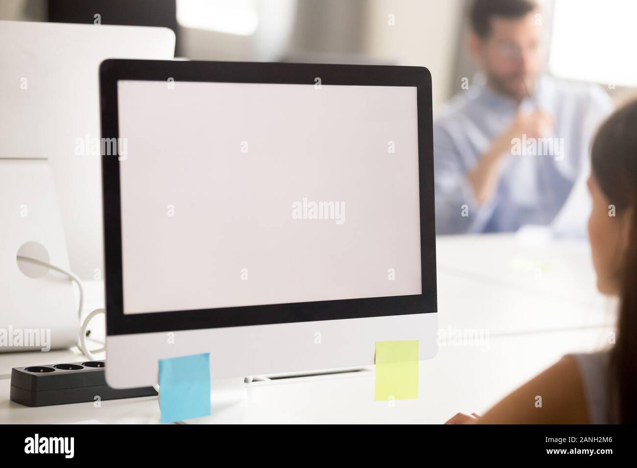 Close up of focused woman working on computer in shared office looking ...