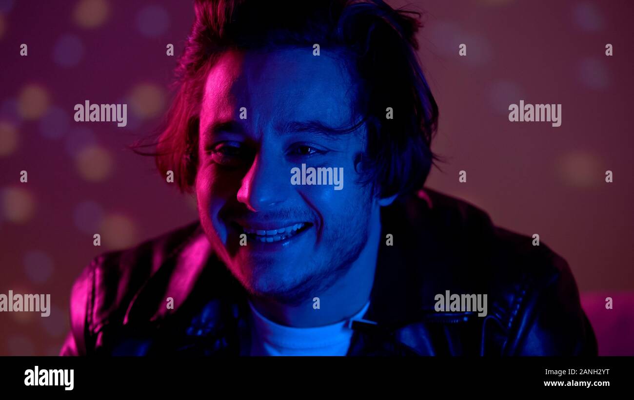 Emotional drunk man laughing and crying at party, confused and lost in ...