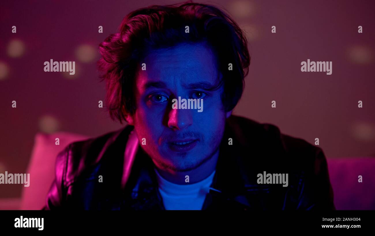 Helpless male drug addict looking at camera about to cry, needs ...