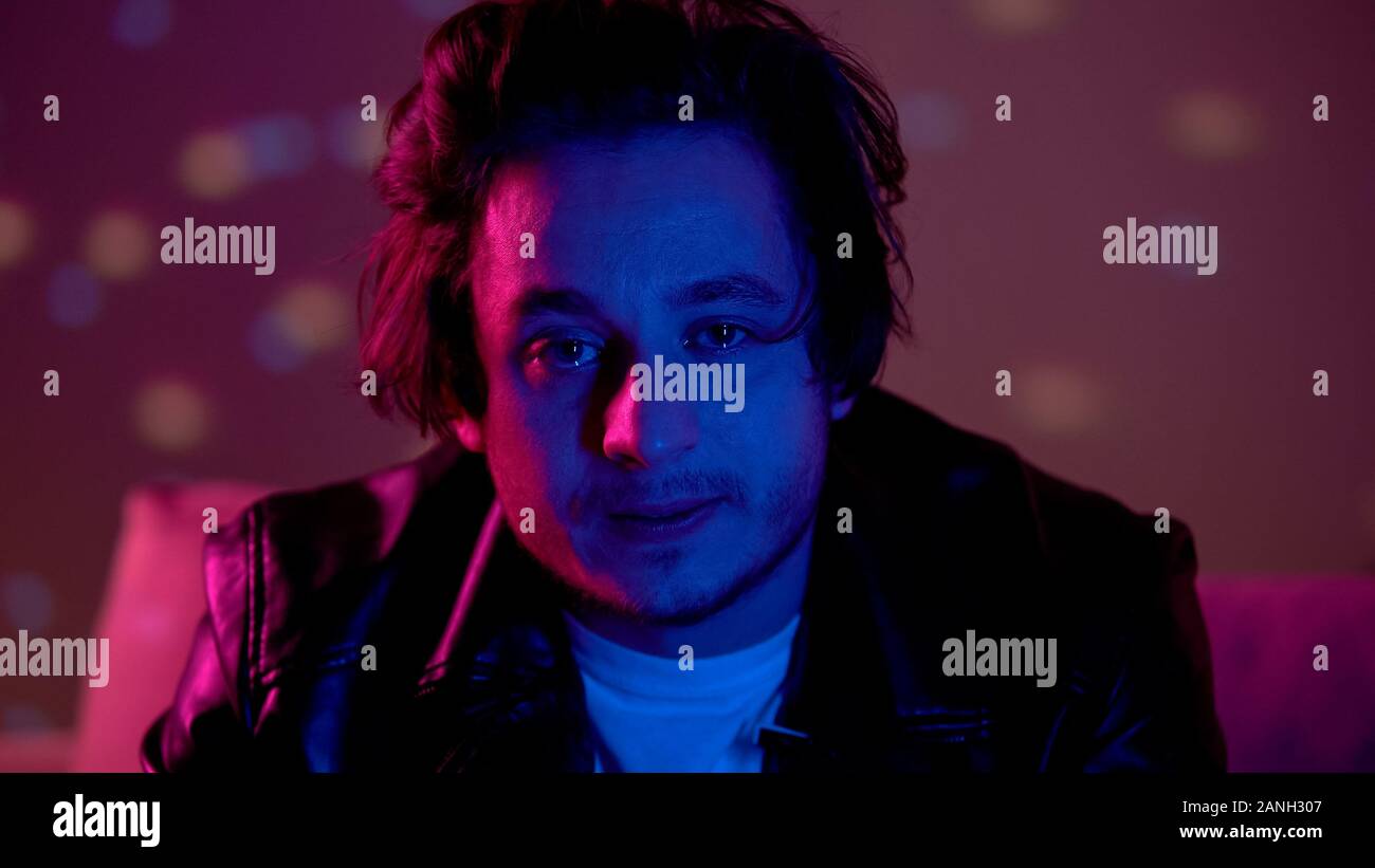 Upset male looking at camera with eyes full of tears, drug addiction ...