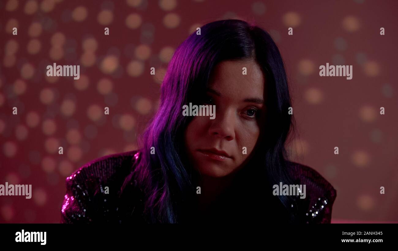 Woman addicted to drugs or alcohol with absent look, wasting life at ...