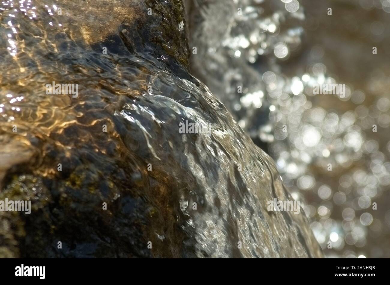 Pure clean flowing water in a mountain stream Stock Photo - Alamy