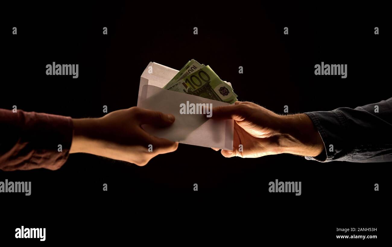 Male giving person envelope with euros, bribery and corruption concept ...