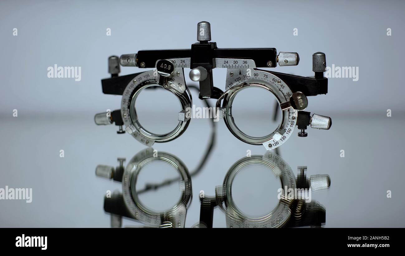 Special vision check glasses lying on glass surface, diagnosis of eye ...