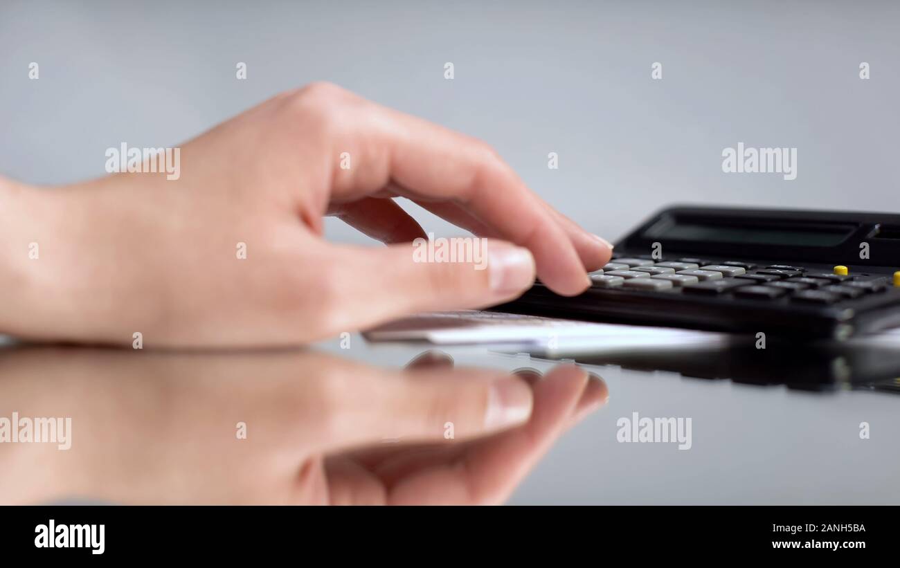 Female accountant hand working in office, calculating expenses and ...