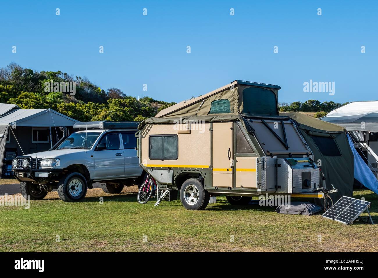 Off road caravan with four wheel drive vehicle in a holiday park, South ...
